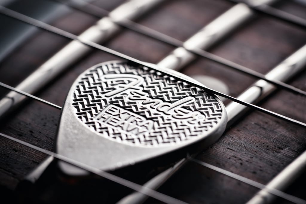 Fender's sterling silver pick and coin: Tone-deaf merch? - gearnews.com