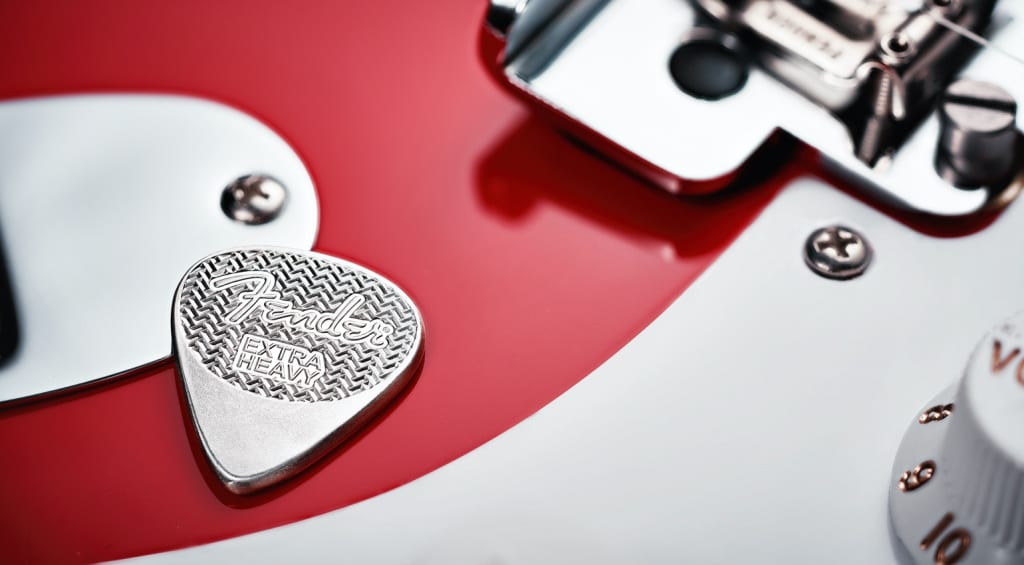 Fender's sterling silver pick and coin: Tone-deaf merch? - gearnews.com