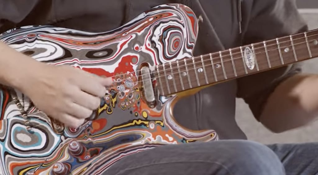 The Story of the Fordite Guitar- an instrument made out of car paint ...